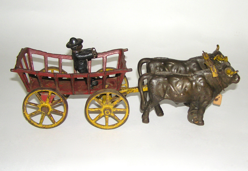 Rare Kenton Cast Iron Farm Stake Cart w/ Two Oxen Standing Driver
